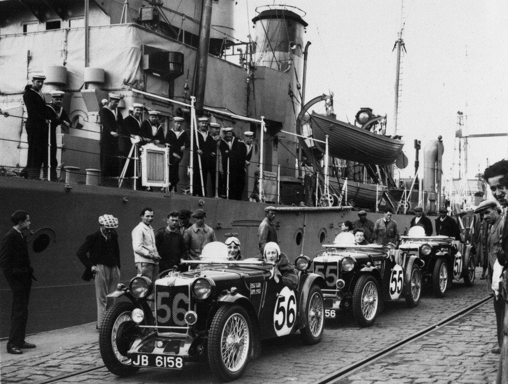 MGs Lined up Beside a Ship 1935 – British Motor Museum